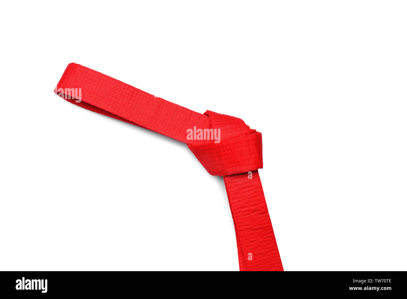Red karate belt on white background Stock Photo - Alamy