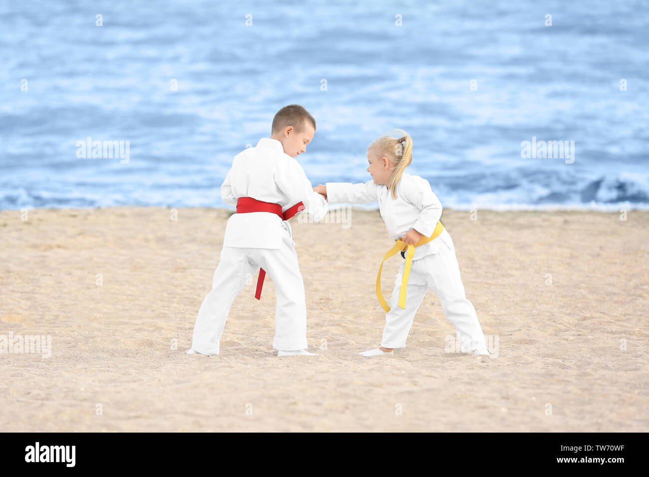 Little children practicing karate outdoors Stock Photo - Alamy