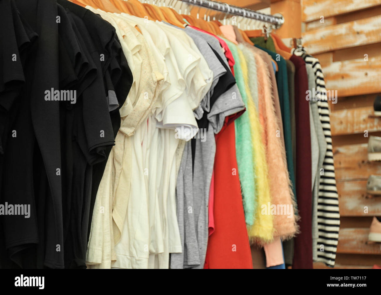 Female clothes on rack in boutique Stock Photo - Alamy