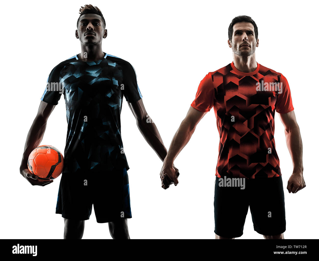 two soccer players men in studio silhouette isolated on white ...