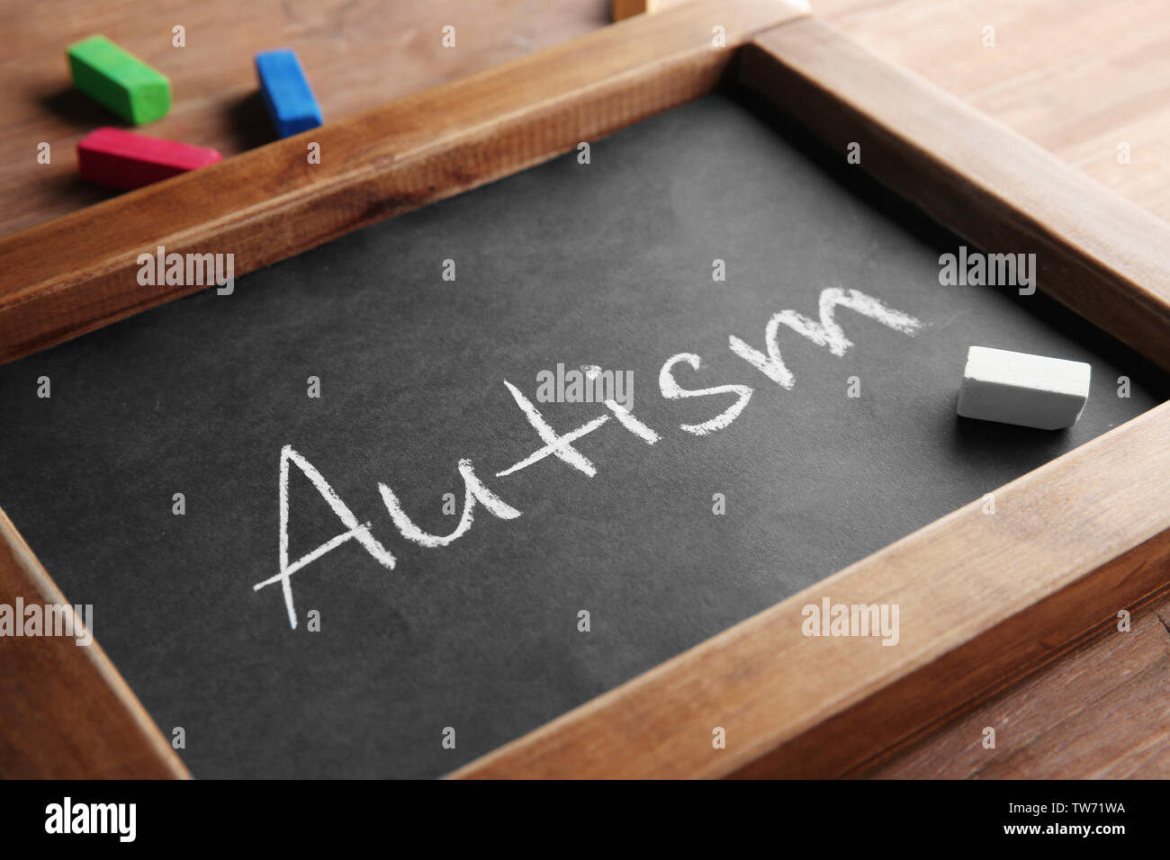 Word "Autism" written on blackboard Stock Photo - Alamy