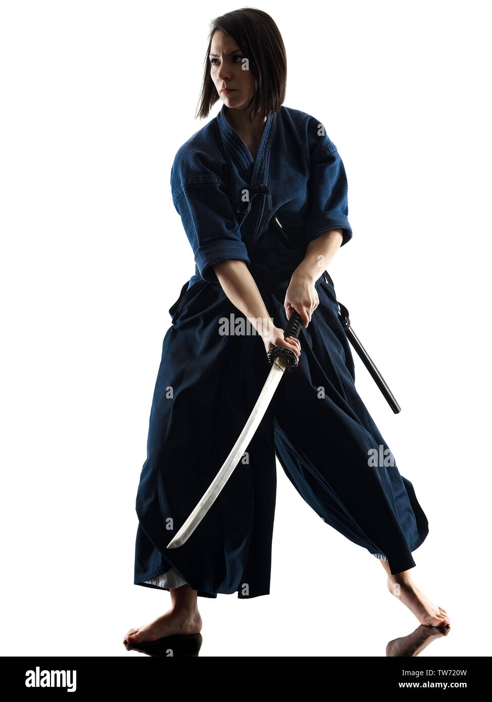 one caucasian woman practicing laido Katori Shinto ryu shadow ...