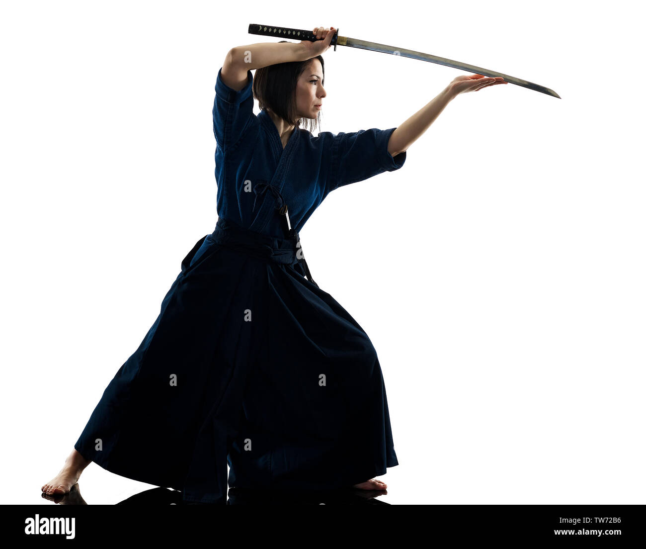 one caucasian woman practicing laido Katori Shinto ryu shadow ...