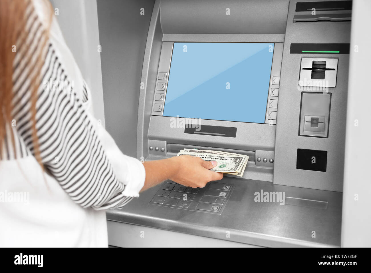Taking cash from atm hi-res stock photography and images - Alamy