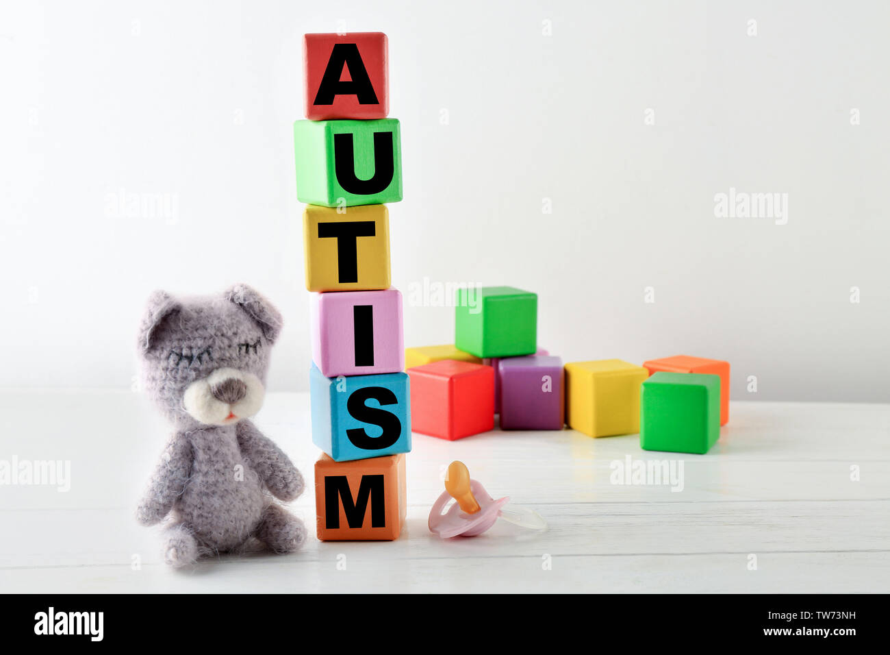 Child cubes word autism hi-res stock photography and images - Alamy