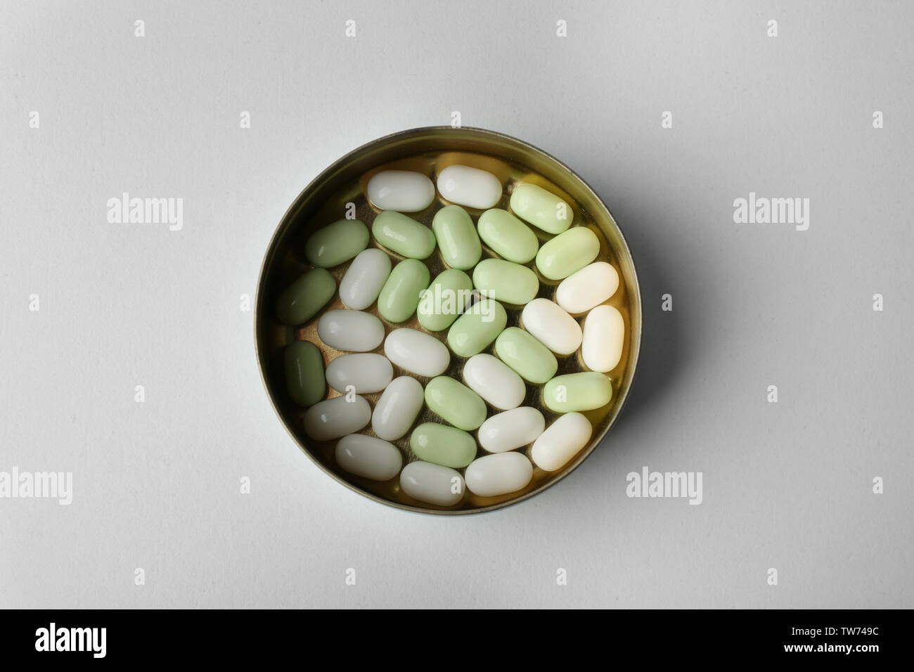 Box with hard mint candies on white background Stock Photo - Alamy