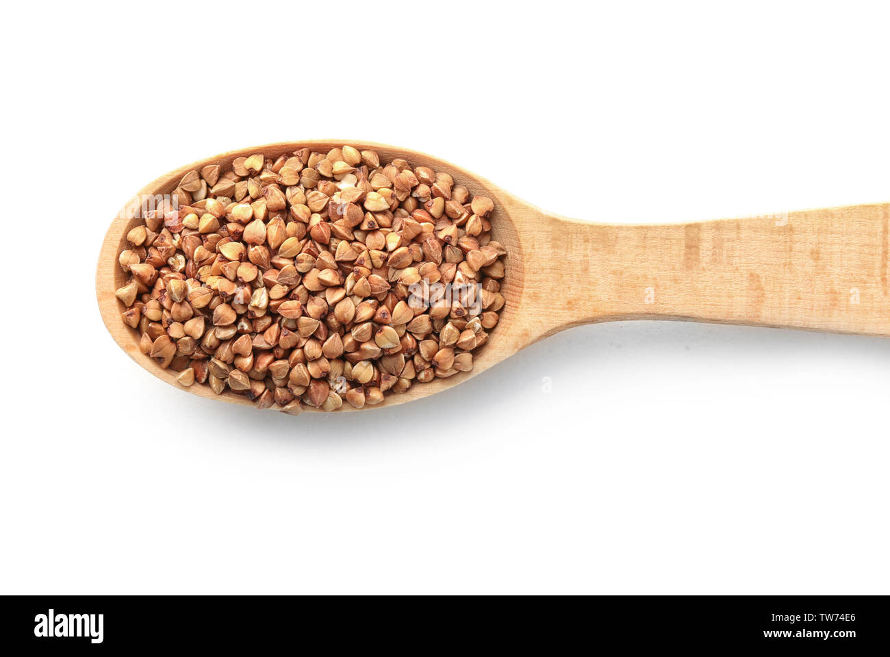 Raw buckwheat in wooden spoon on white background Stock Photo - Alamy