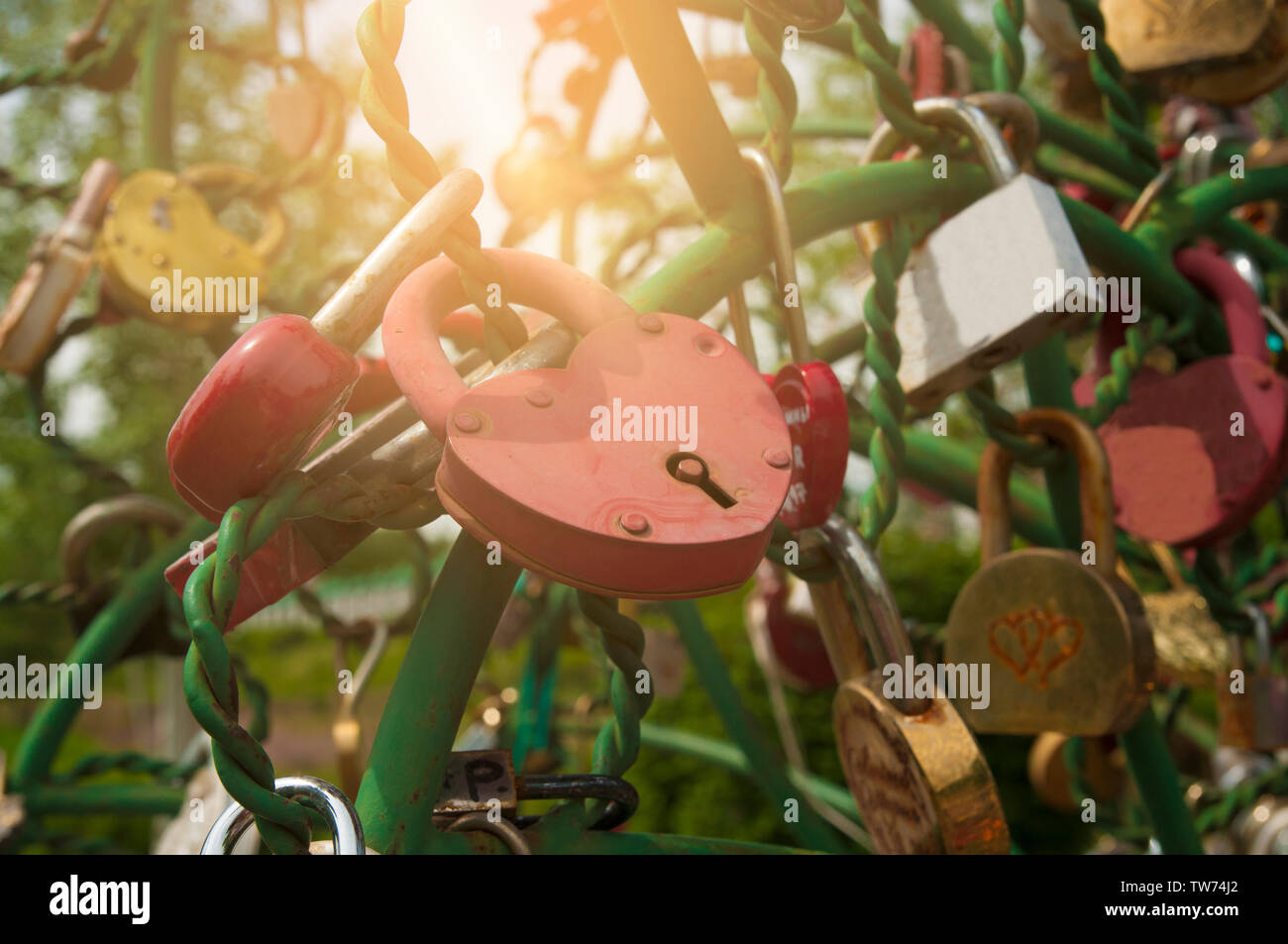 wedding padlock of different colors and shapes in the sun Stock Photo ...