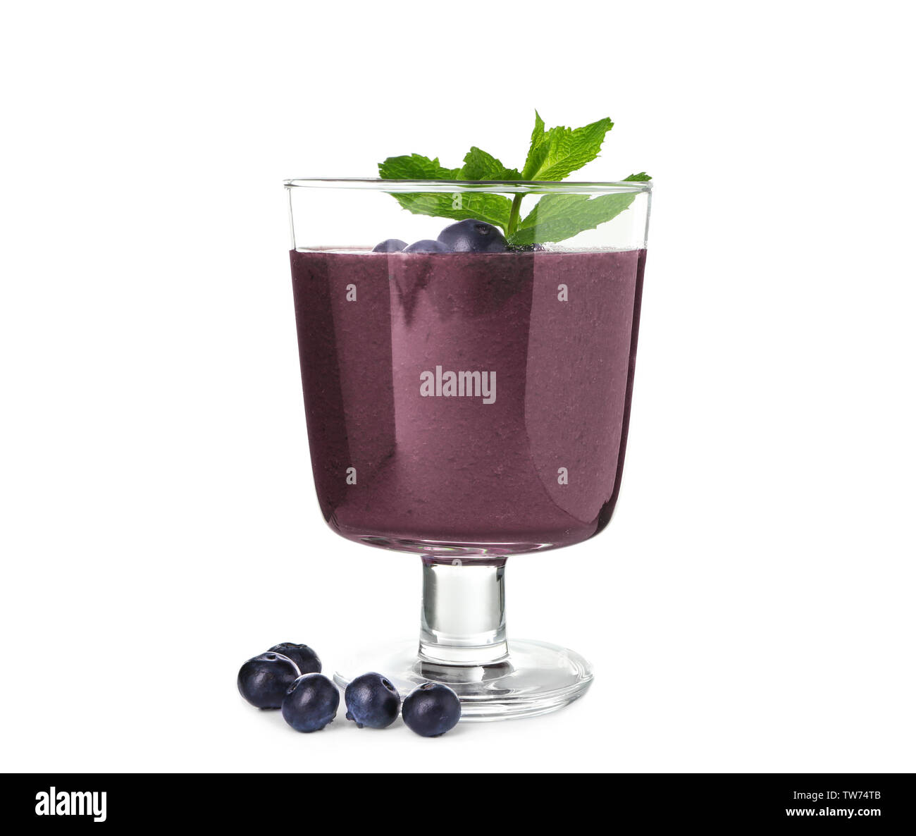 Glass with acai juice and berries on white background Stock Photo - Alamy