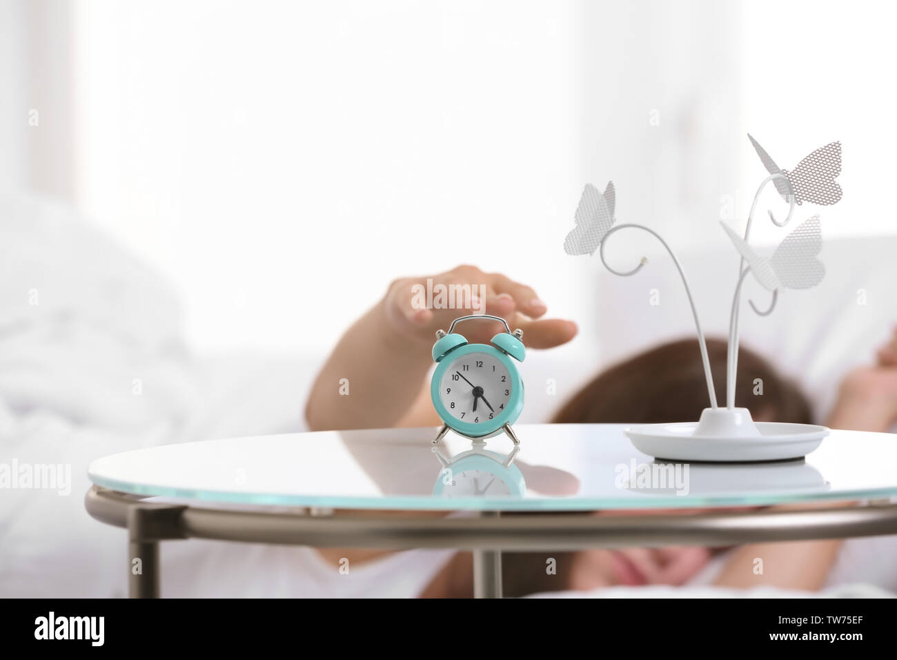 Turning off alarm clock hi-res stock photography and images - Alamy