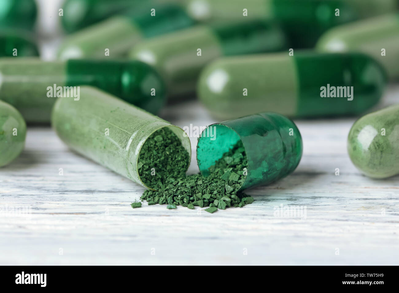 Green natural supplement capsules close hi-res stock photography and ...