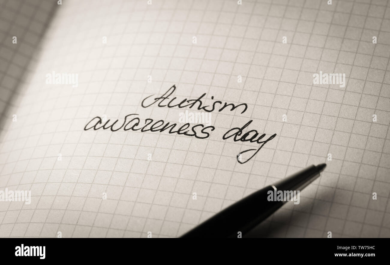Text AUTISM AWARENESS DAY written in notebook, close up Stock Photo - Alamy