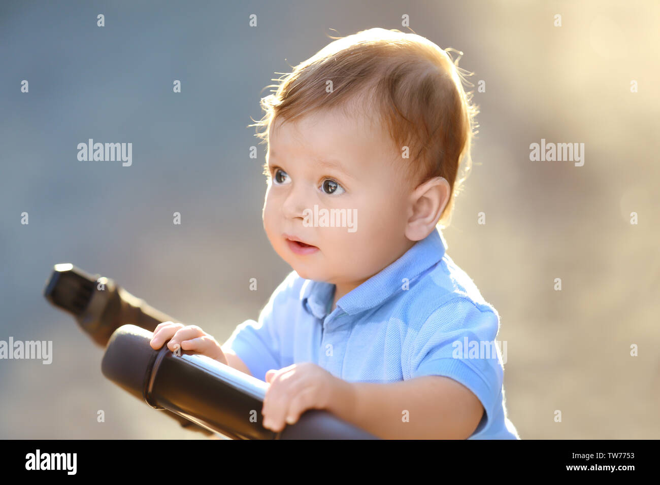 Cute baby boy in stroller, outdoors Stock Photo - Alamy