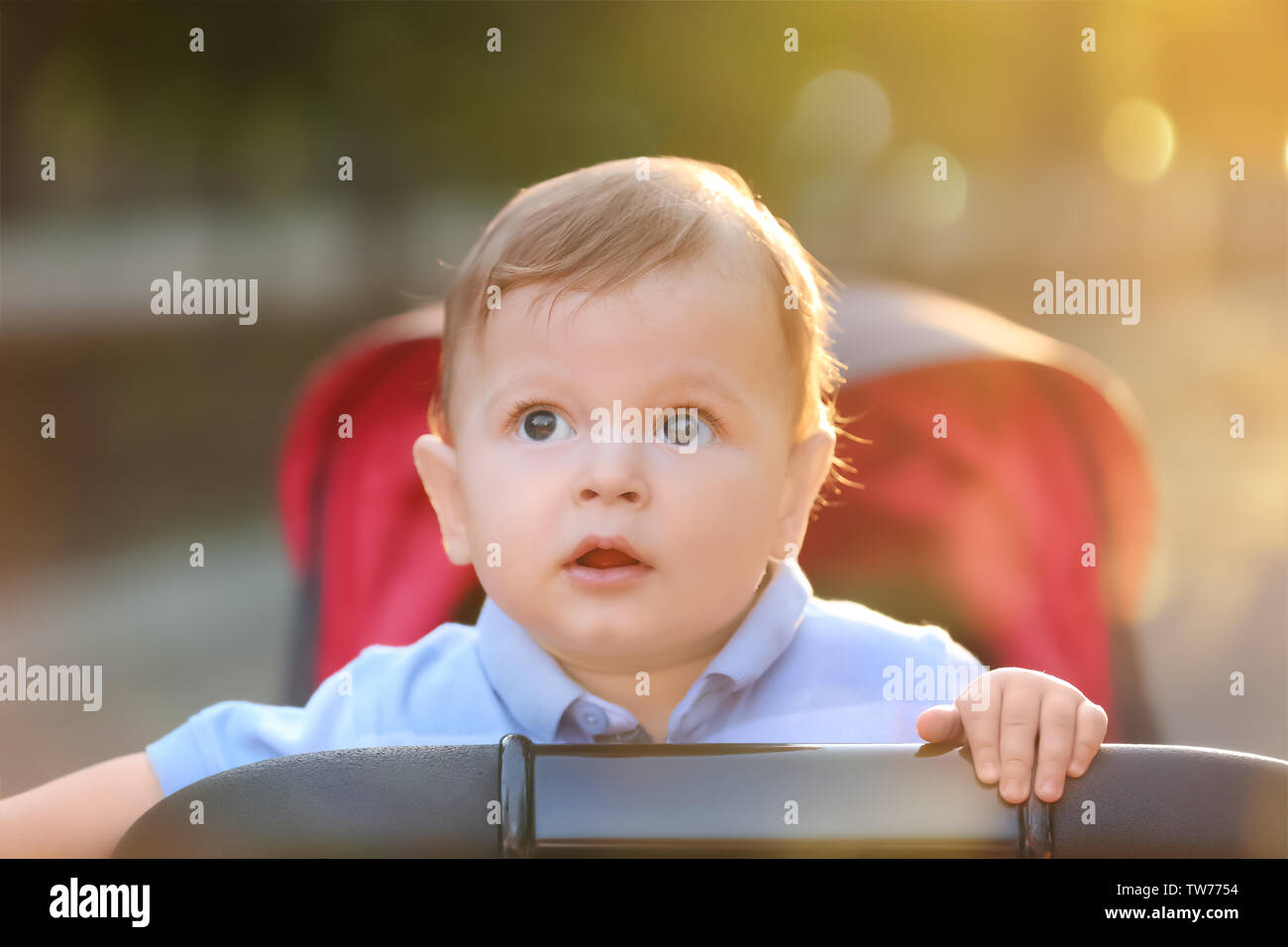 Cute baby boy in stroller, outdoors Stock Photo - Alamy