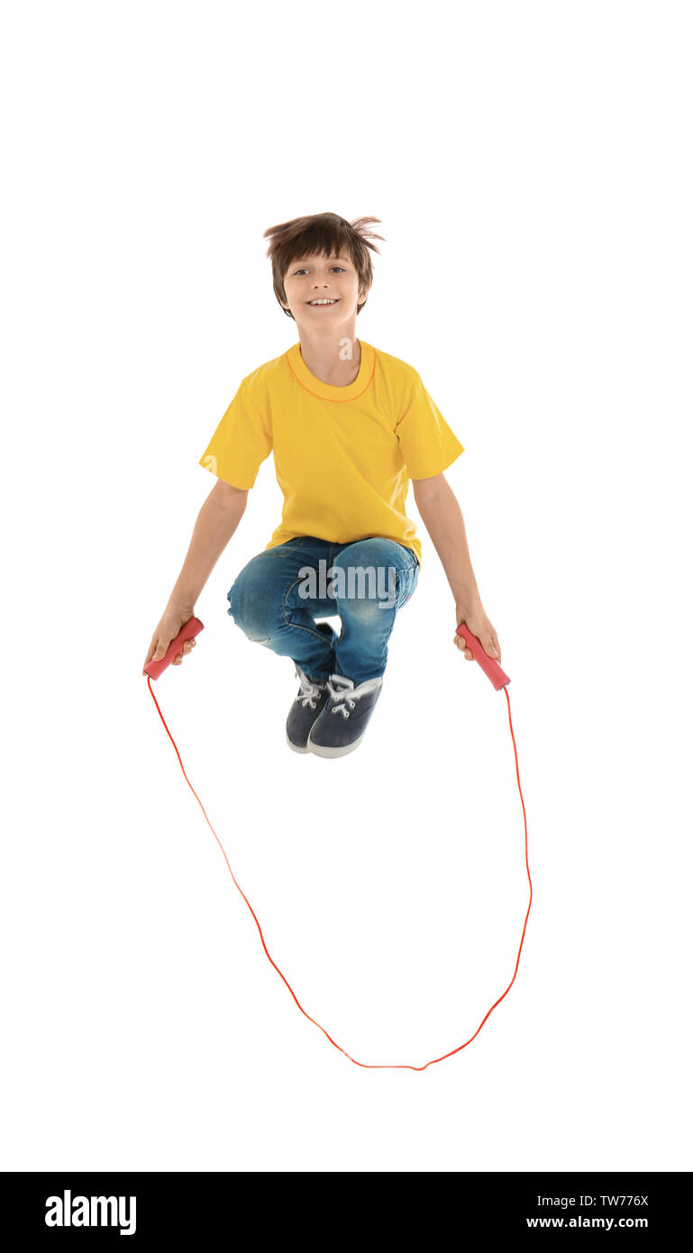 Cute little boy jumping rope on white background Stock Photo - Alamy