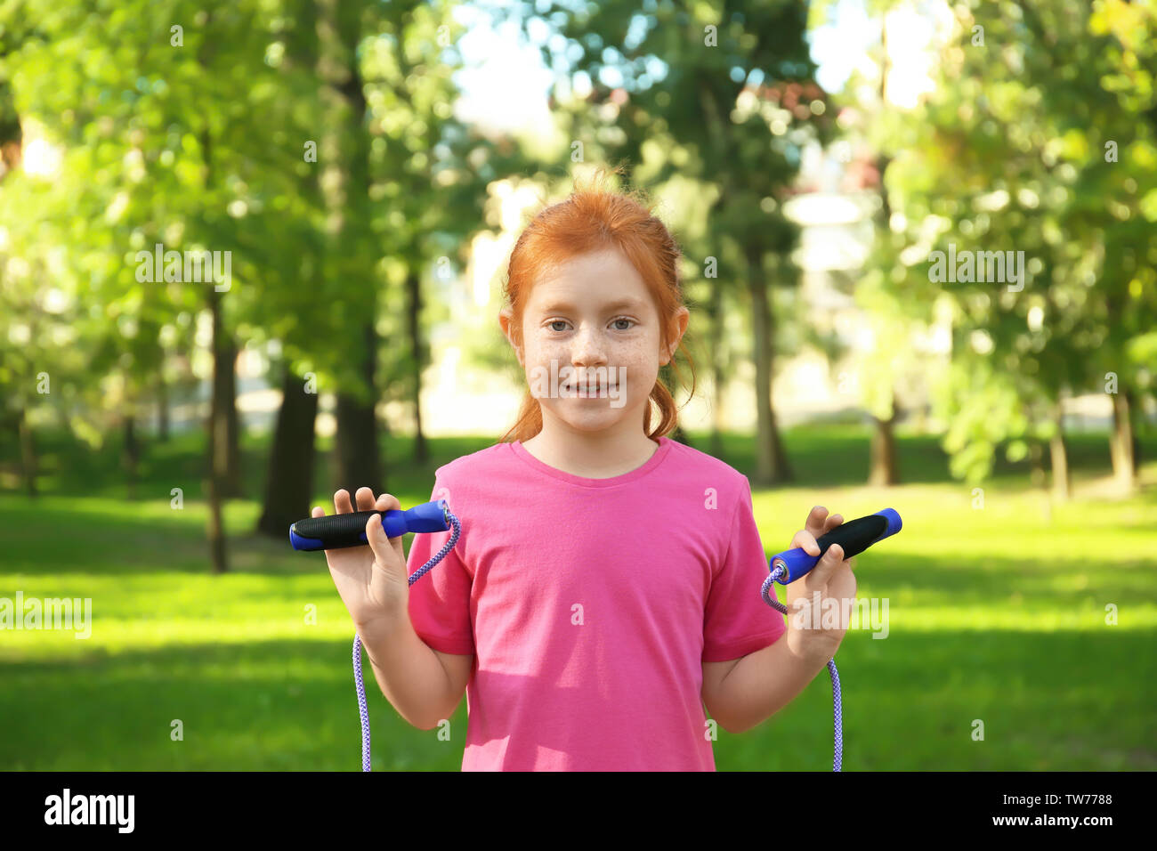 Little girl jumping rope hi-res stock photography and images - Alamy