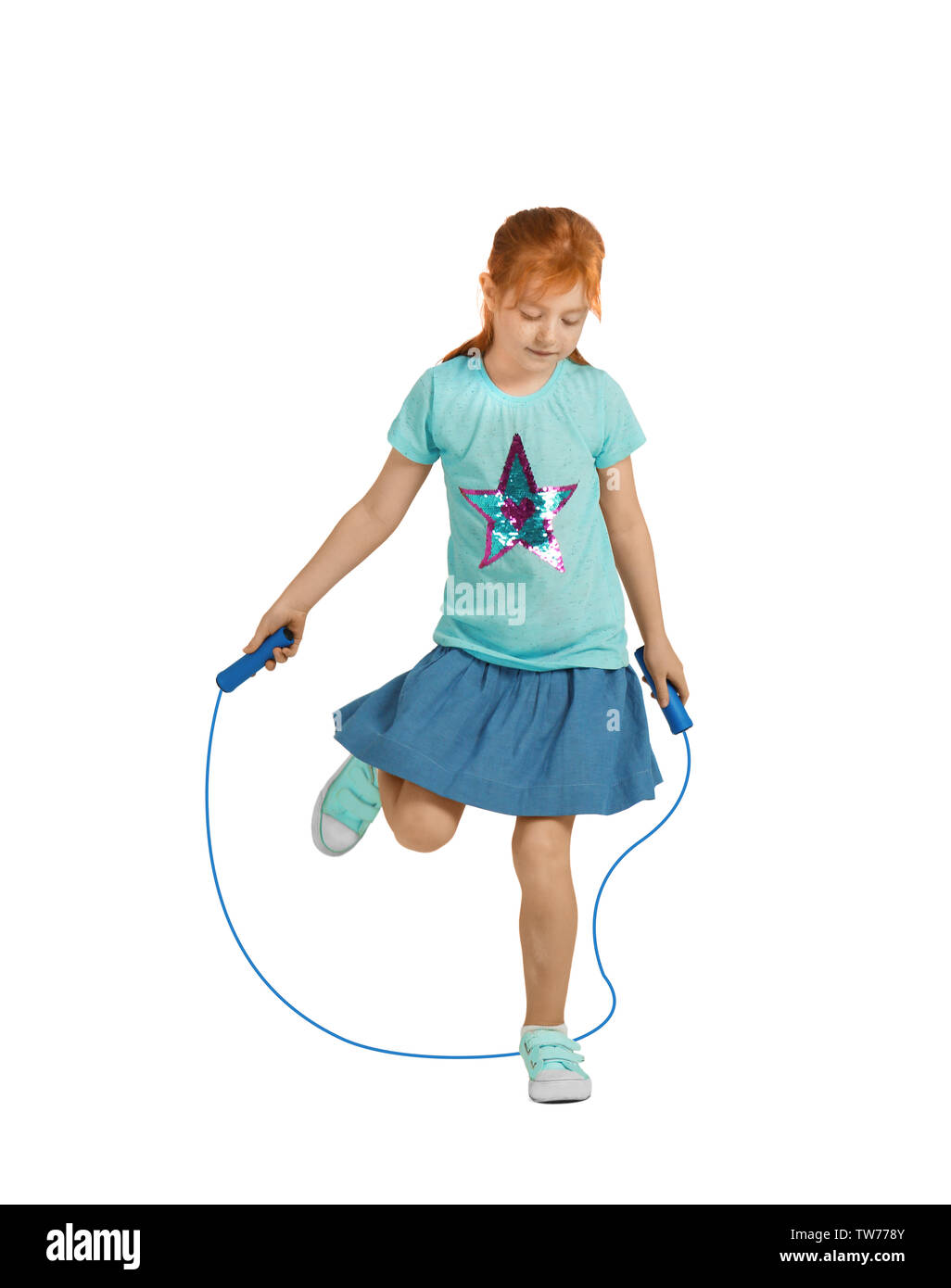 Cute little girl jumping rope on white background Stock Photo - Alamy