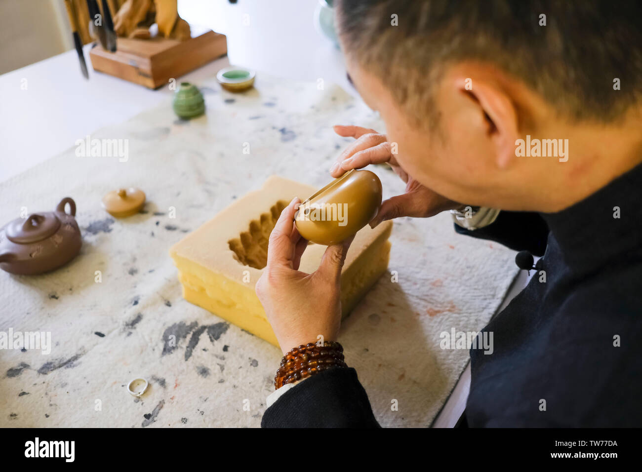Making purple sand pots Stock Photo - Alamy