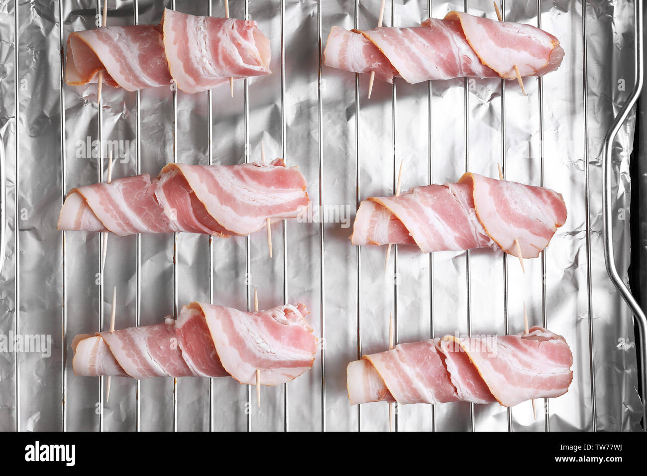 Bacon wrapped chicken nuggets on baking rack Stock Photo - Alamy