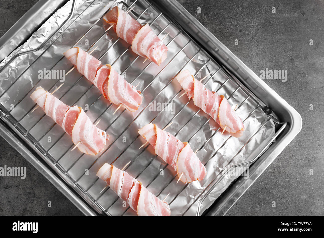Bacon wrapped chicken nuggets on baking rack Stock Photo - Alamy