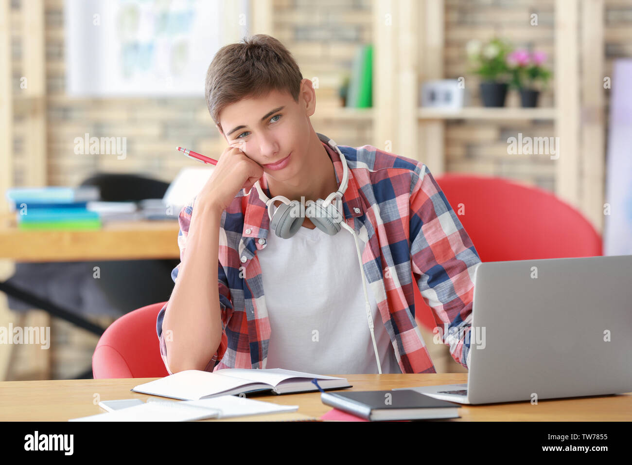 Student with laptop studying indoors Stock Photo - Alamy