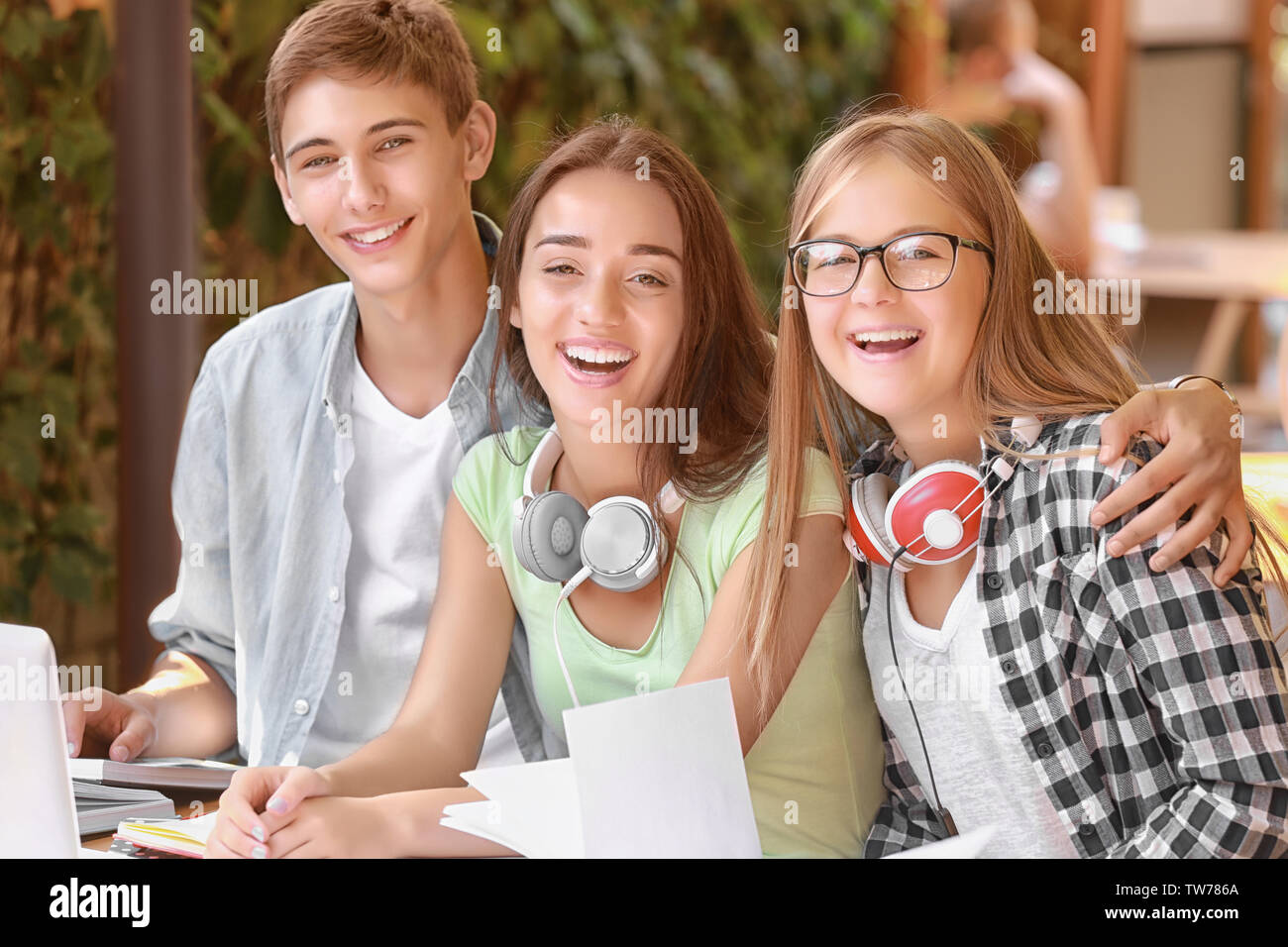 Happy students studying together outdoors Stock Photo - Alamy