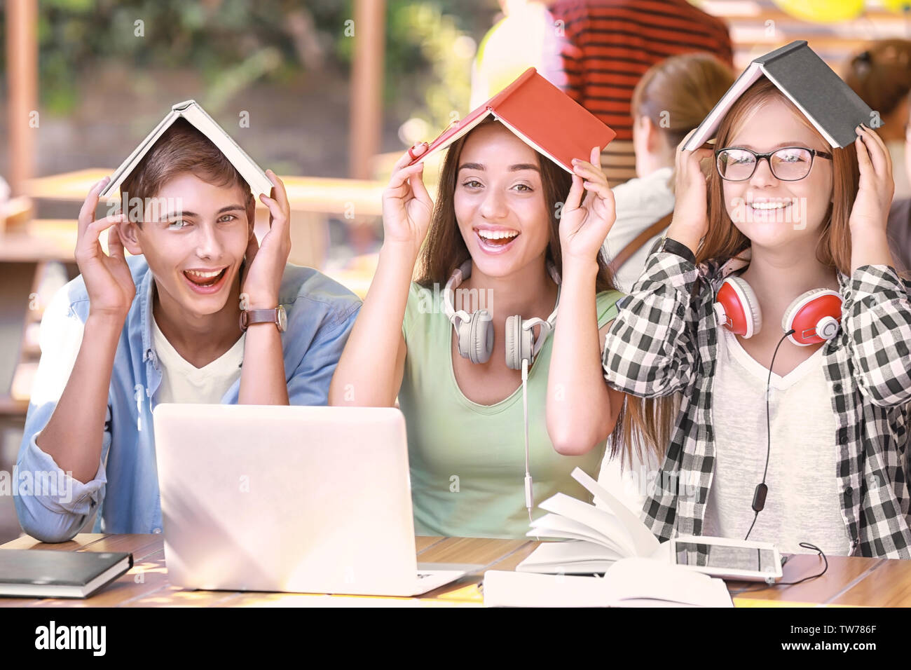 Happy students studying together outdoors Stock Photo - Alamy
