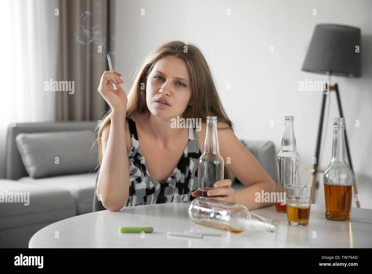 Woman smoking cigarette drinking alcohol hi-res stock photography and ...