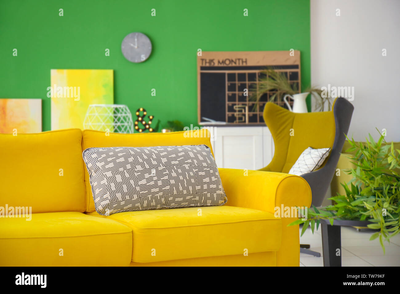 Bright yellow sofa in modern interior Stock Photo - Alamy