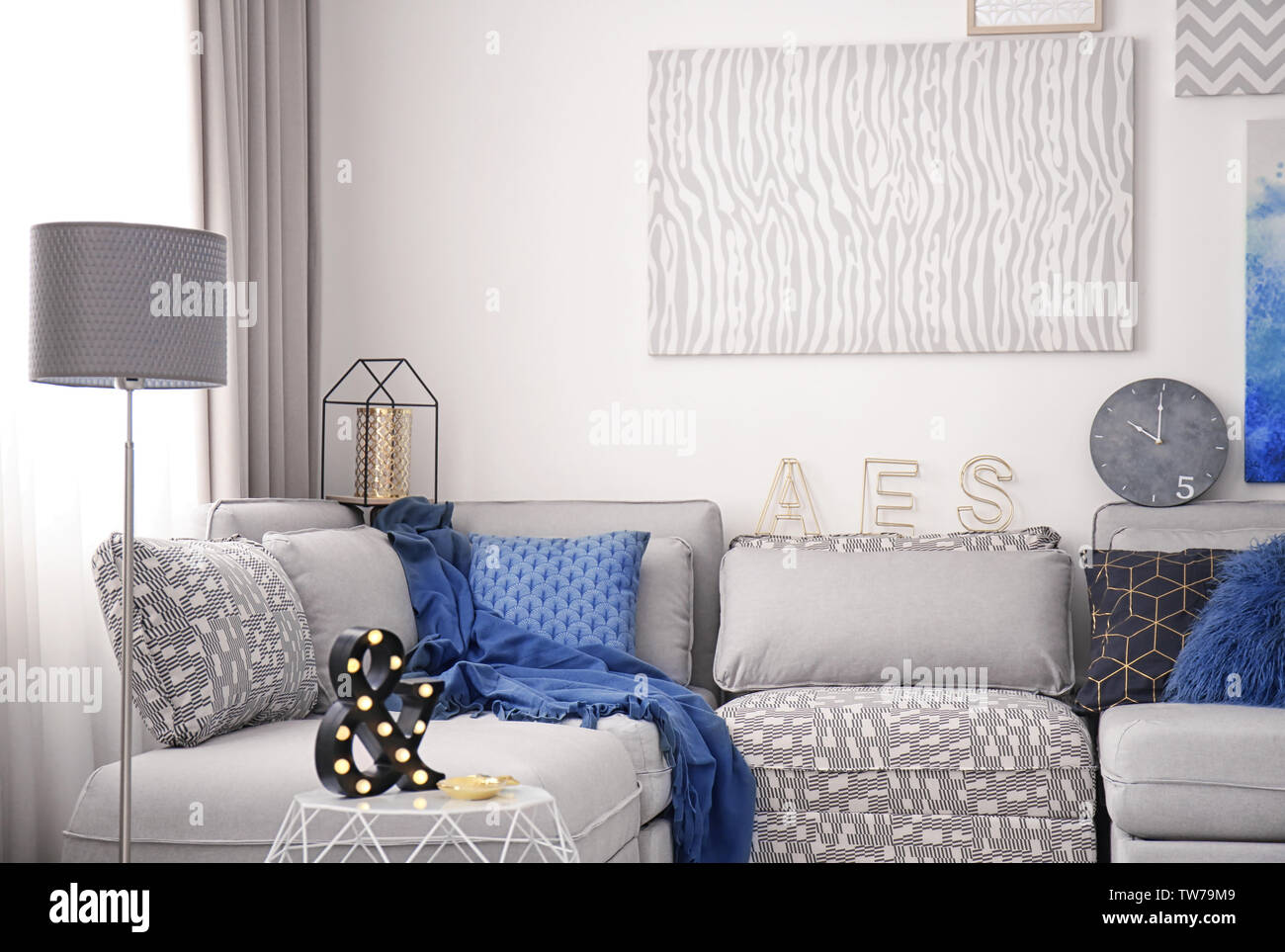 Modern interior with comfortable sofa Stock Photo - Alamy