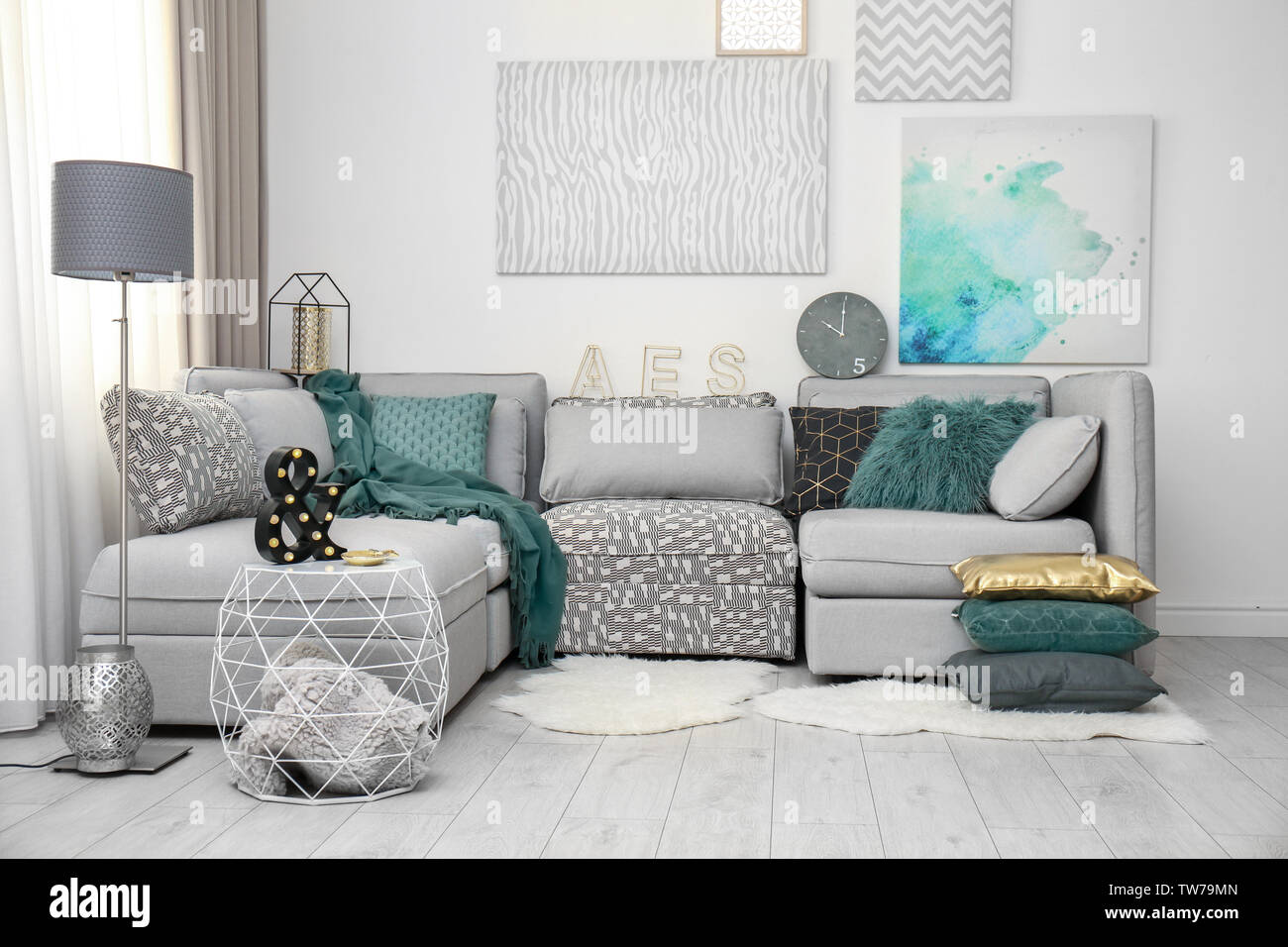 Modern interior with comfortable sofa Stock Photo - Alamy