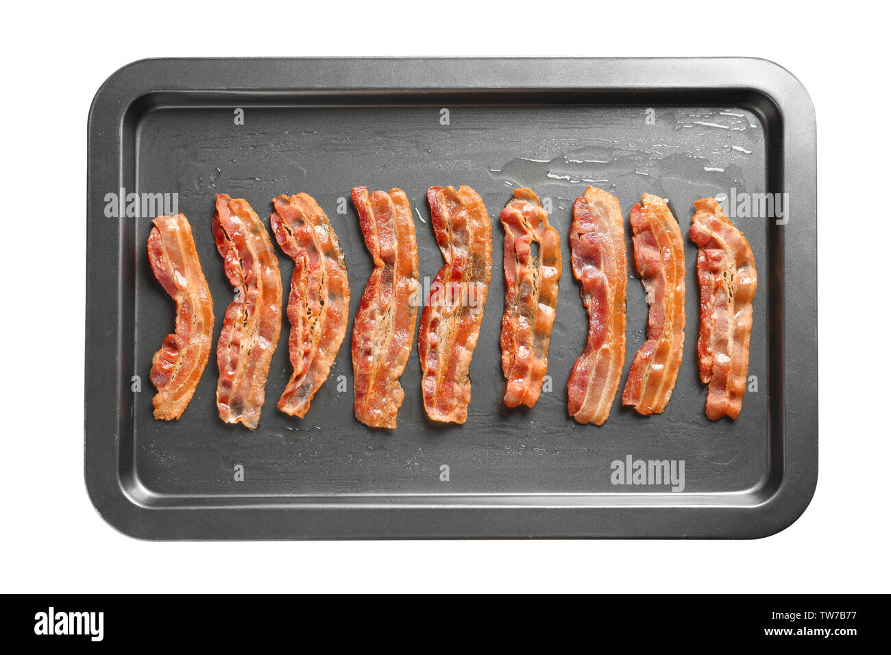 Baking tray with cooked bacon rashers, isolated on white Stock Photo ...