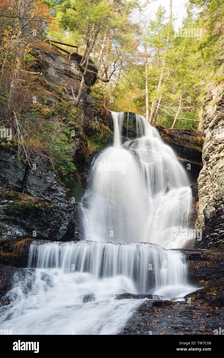 Waterfall in mountain with Autumn foliage and woods over rocks Stock ...