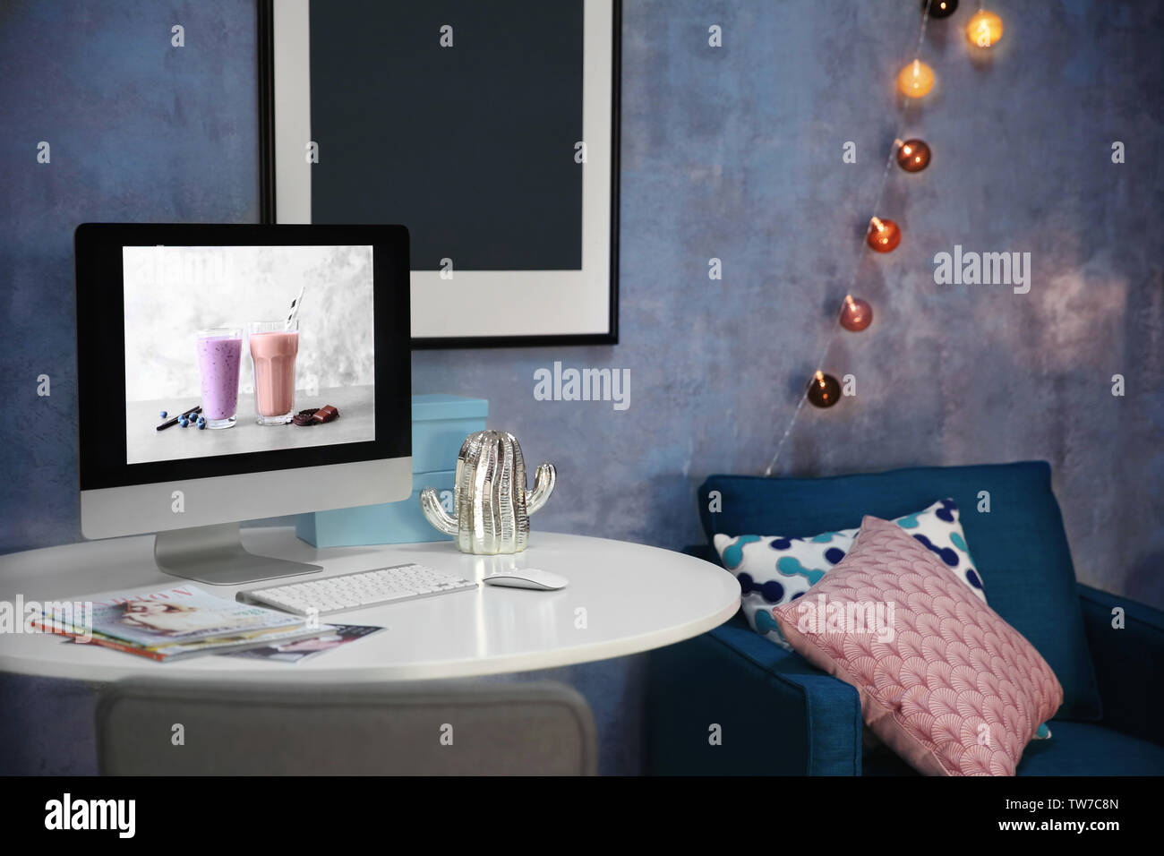 Comfortable workplace with monitor in interior of beautiful modern room ...