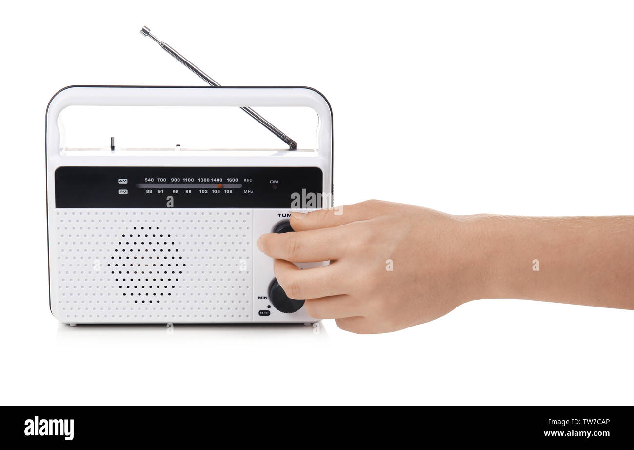 Hand of young woman with retro radio receiver on white background Stock ...