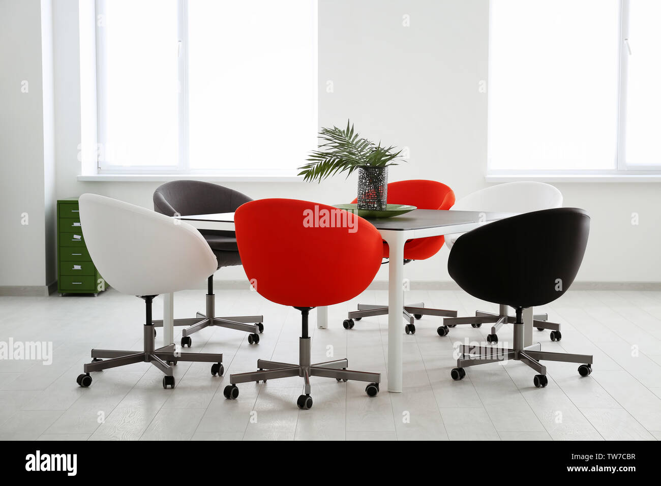 Modern room interior with big table and chairs Stock Photo - Alamy