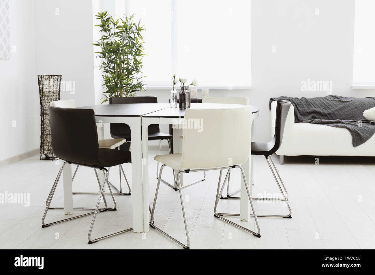 Modern room interior with big table and chairs Stock Photo - Alamy