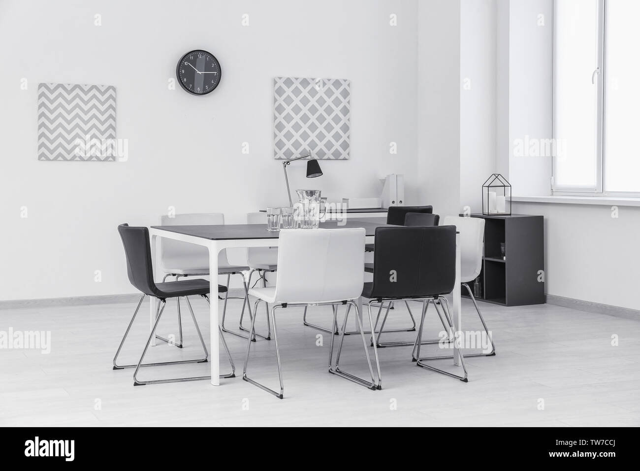 Modern room interior with big table and chairs Stock Photo - Alamy