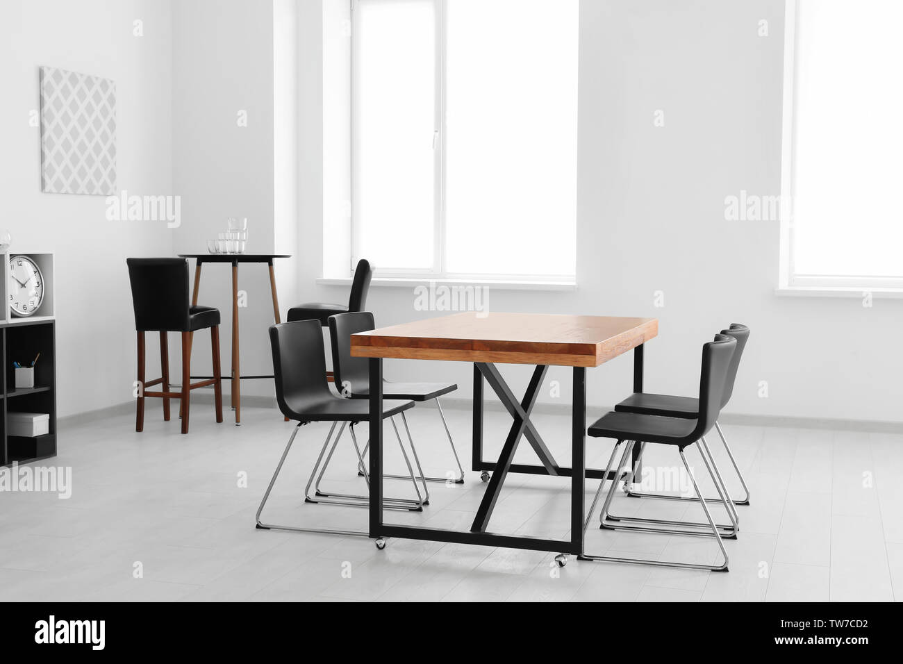 Modern room interior with big table and chairs Stock Photo - Alamy