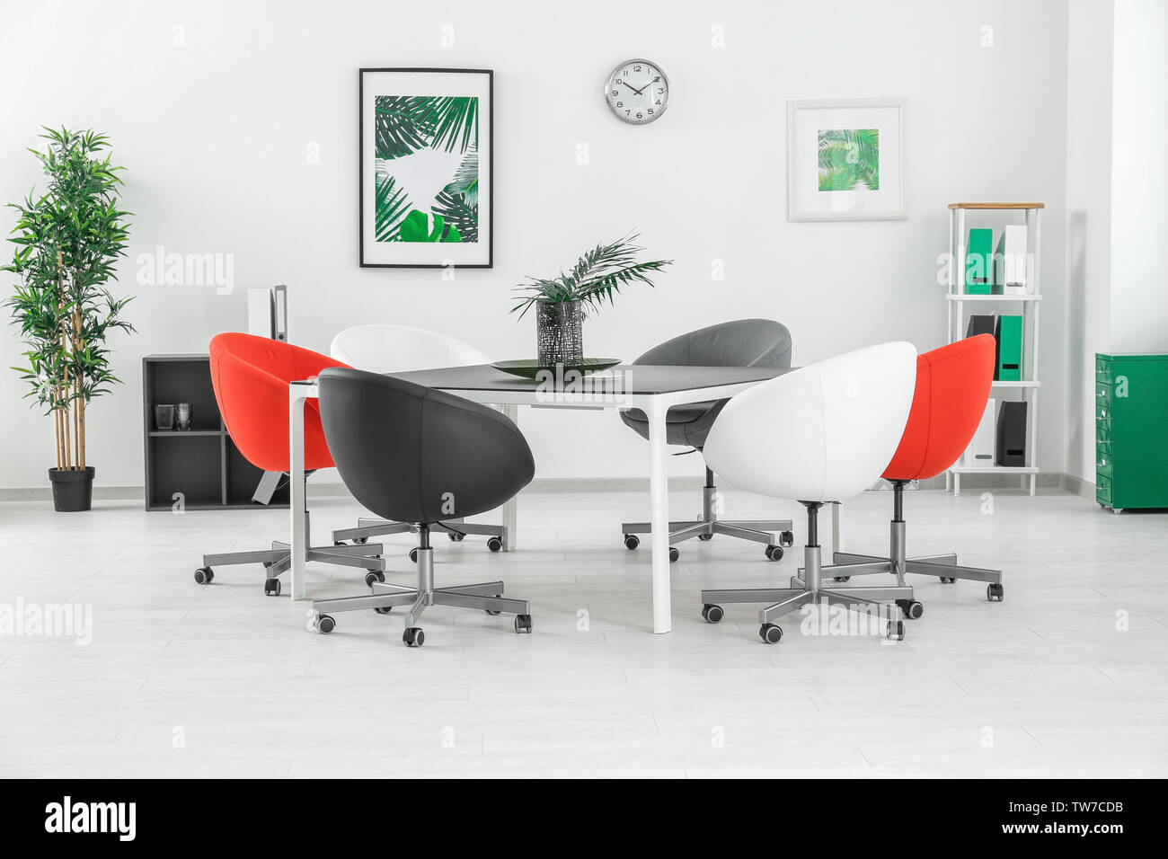 Modern room interior with big table and chairs Stock Photo - Alamy