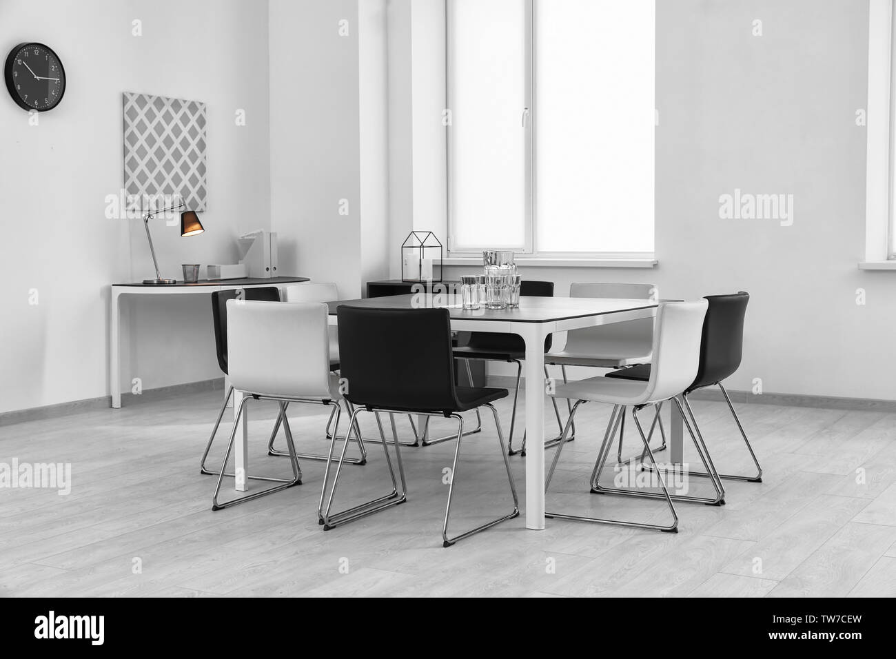 Modern room interior with big table and chairs Stock Photo - Alamy