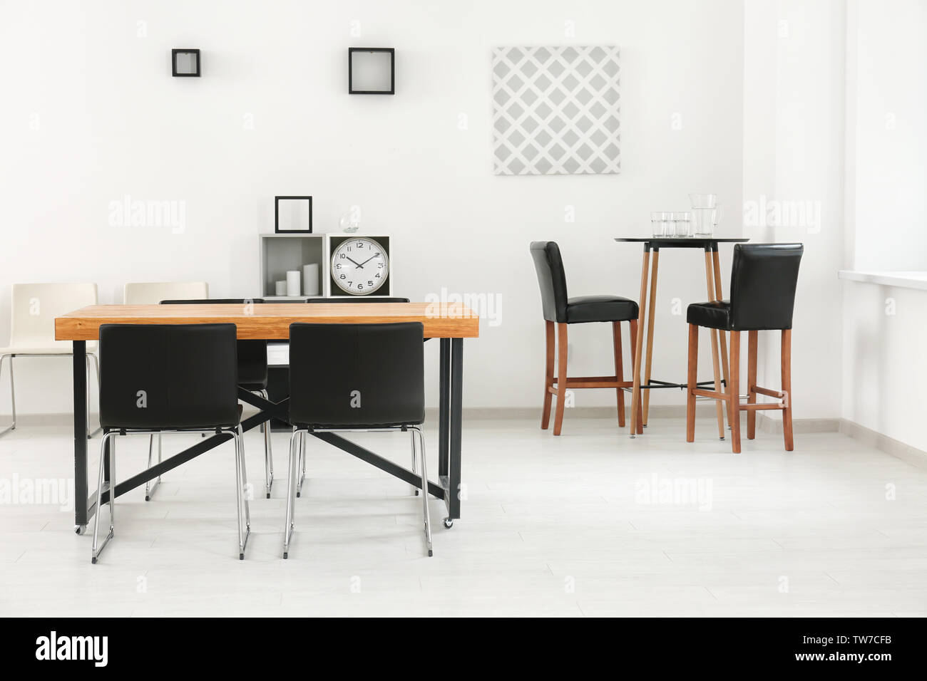 Modern room interior with big table and chairs Stock Photo - Alamy