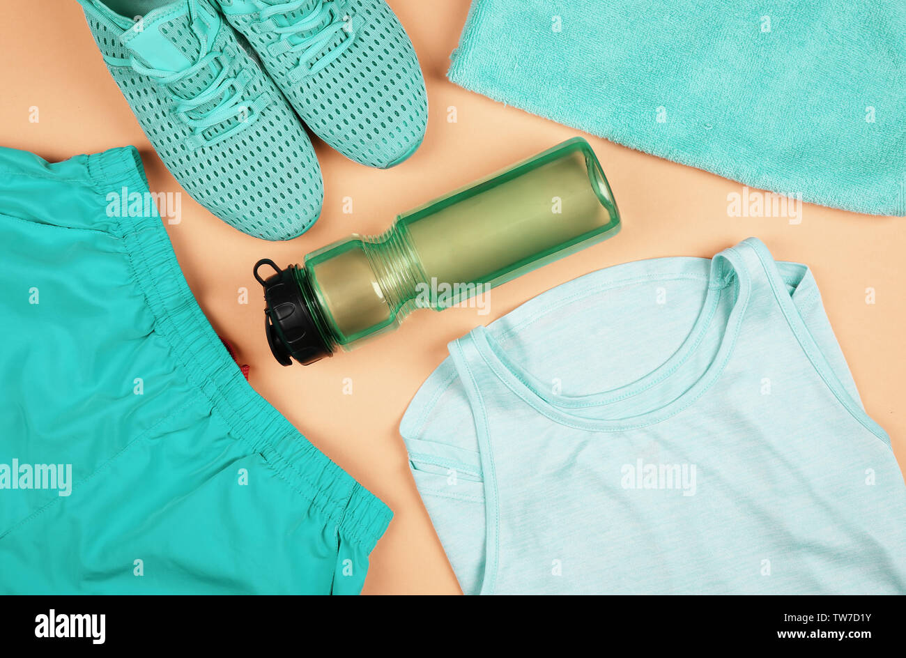 Composition with mint color clothes on apricot background Stock Photo ...