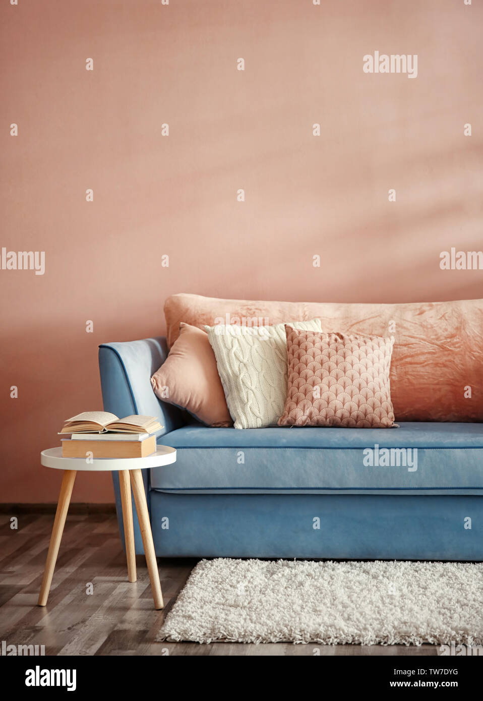 Modern room design with blue sofa Stock Photo - Alamy