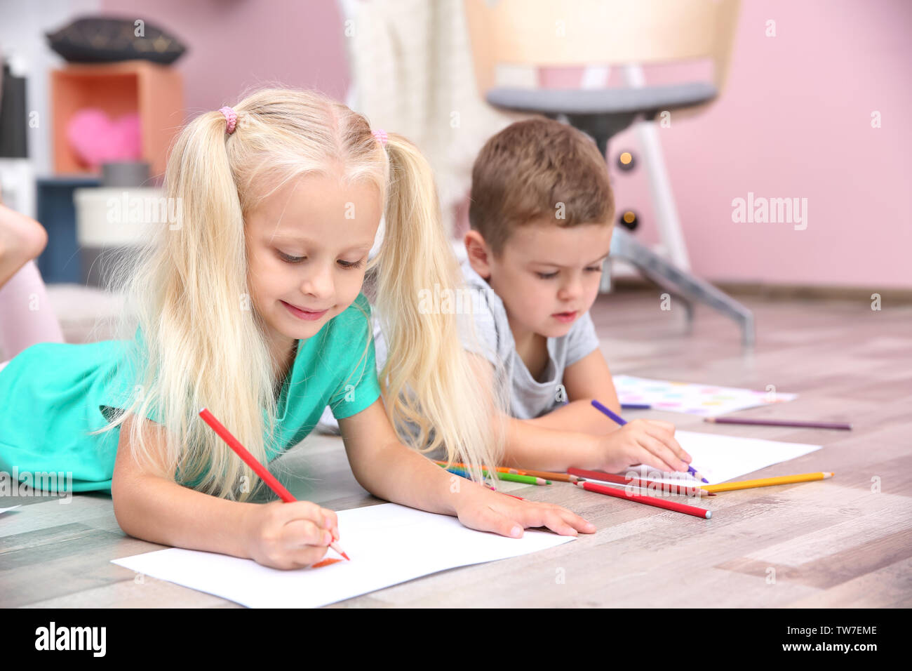 Cute little children drawing at home Stock Photo - Alamy