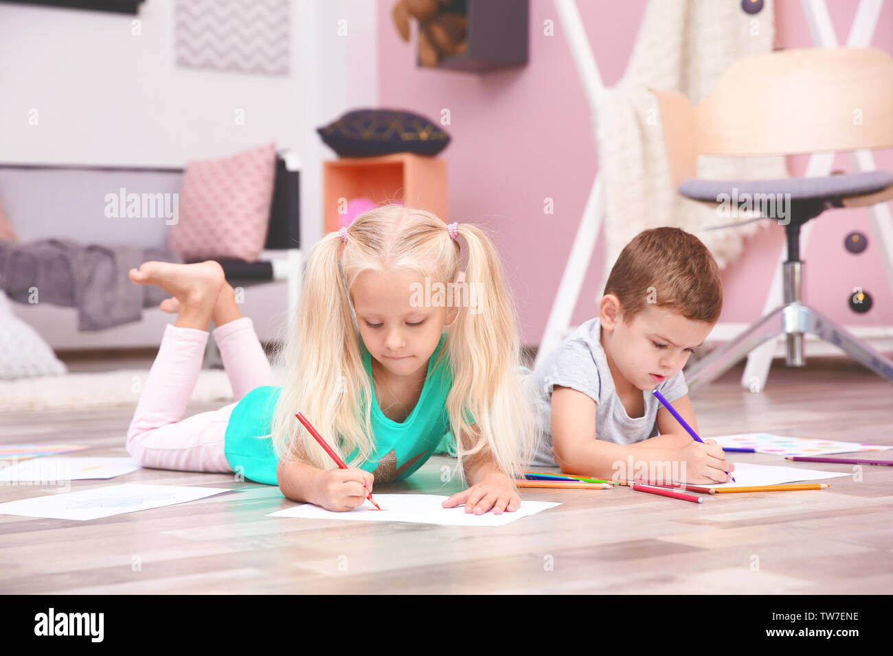 Cute little children drawing at home Stock Photo - Alamy