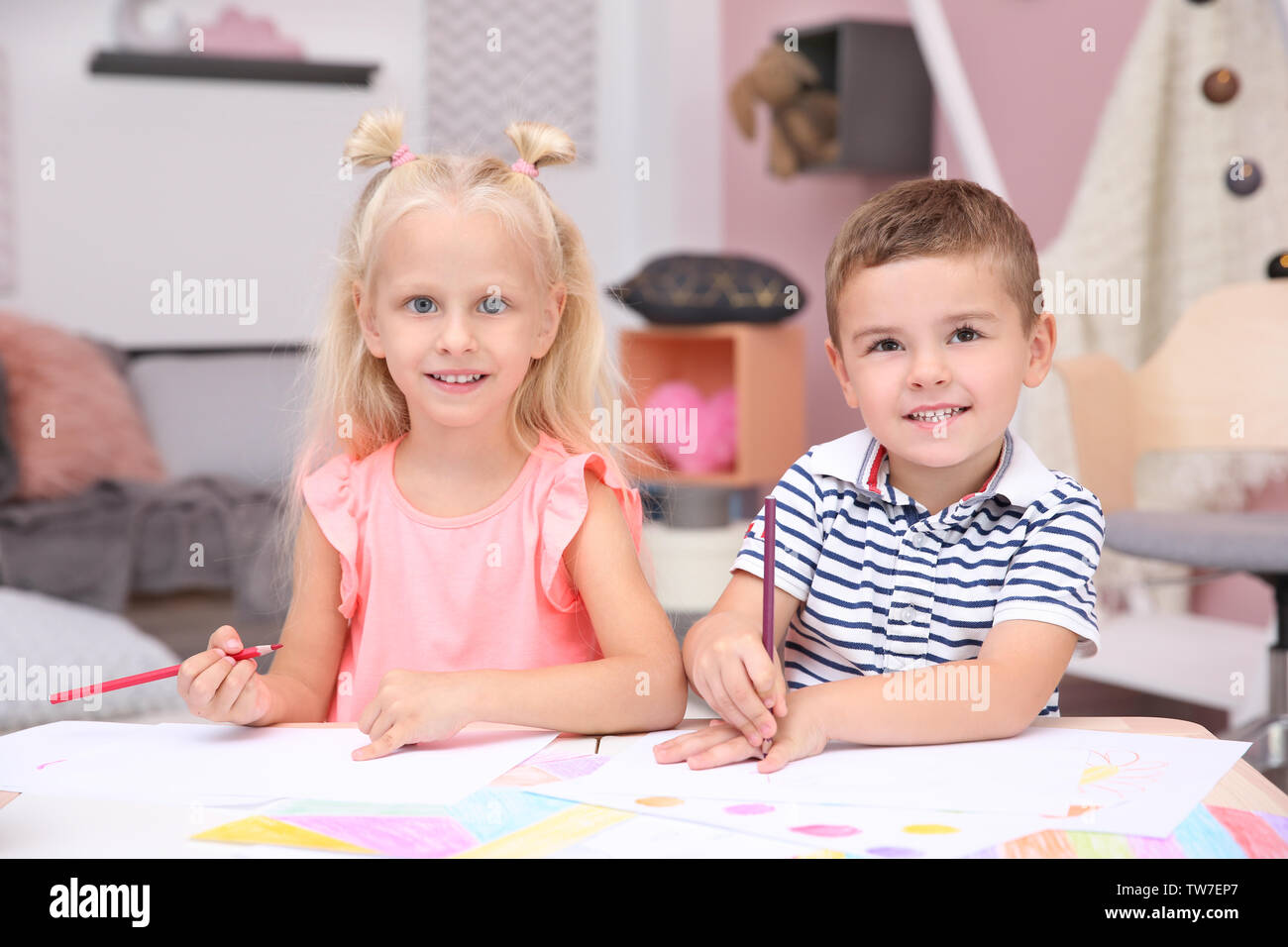 Cute little children drawing at home Stock Photo - Alamy