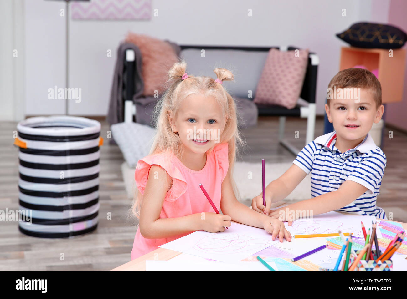 Cute little children drawing at home Stock Photo - Alamy