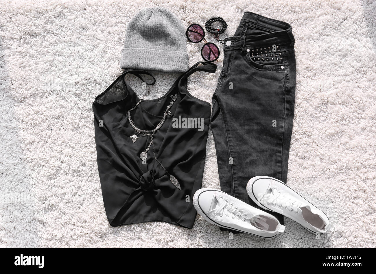 Set of stylish female clothes and accessories on fluffy carpet Stock ...