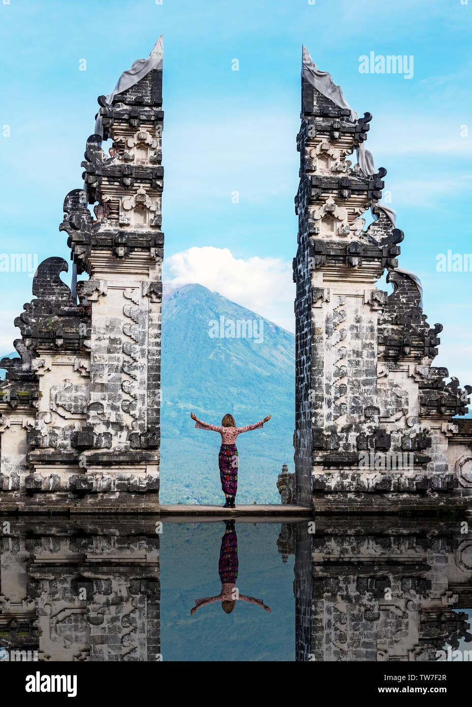 Unidentified person at the gate of Pura Penataran Lempuyang infront of ...